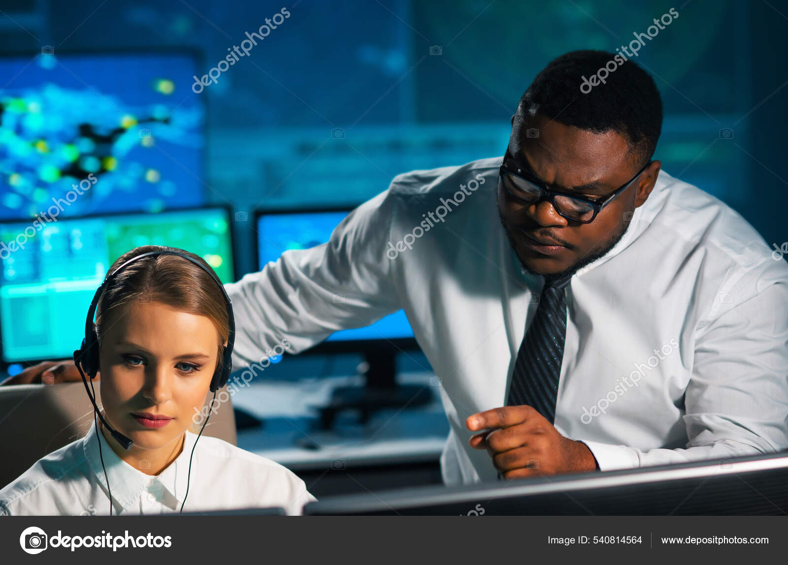 Aircraft flight control officer monitors the approach of aircraft from ...