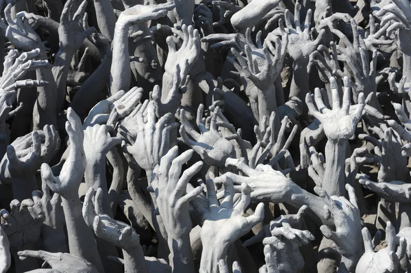 Ancient hands scuplture at White Temple " Wat Rong Khun " in Chiang Rai ...