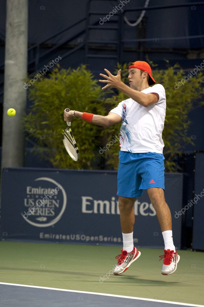 Jack Sock forehands a return to Flavio Cipolla during the tennis match ...