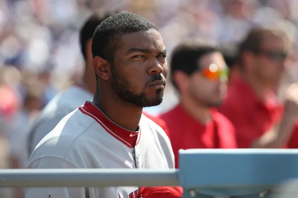 Howard Kendrick stands for the singing of God Bless America during the ...