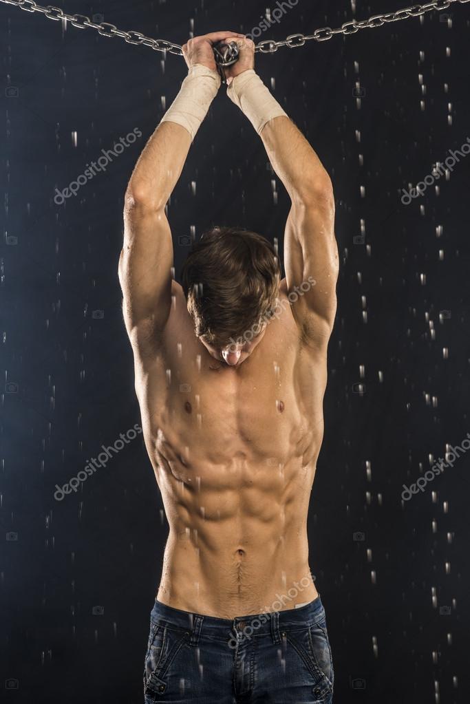 Image of muscle man with chains posing in aqua studio Stock Photo by ...