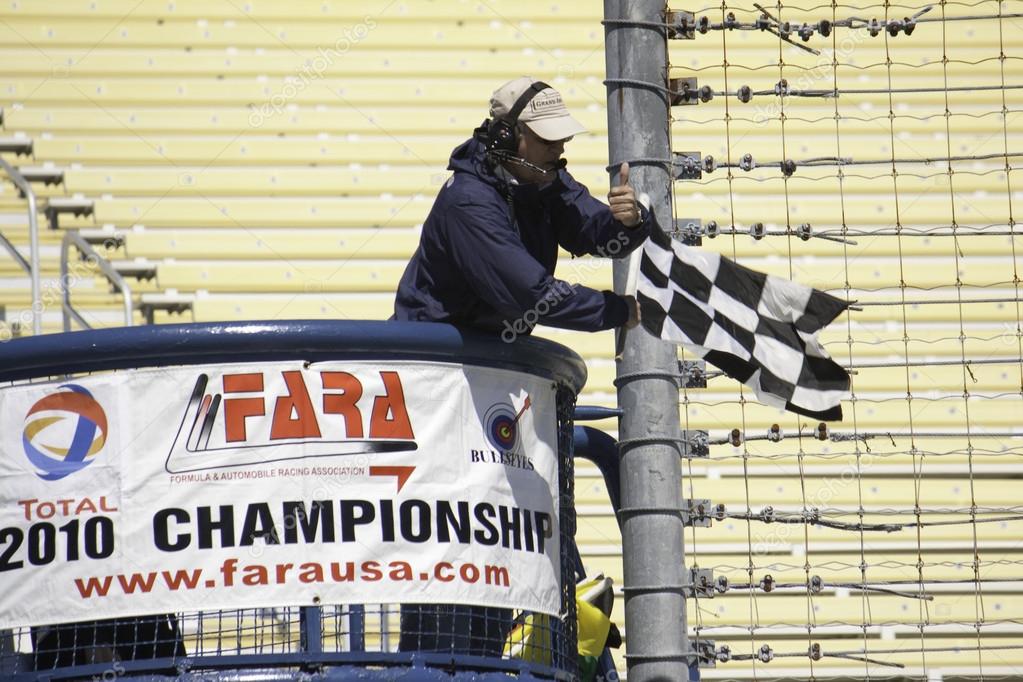 Waving the checkered flag at the finish line – Stock Editorial Photo ...
