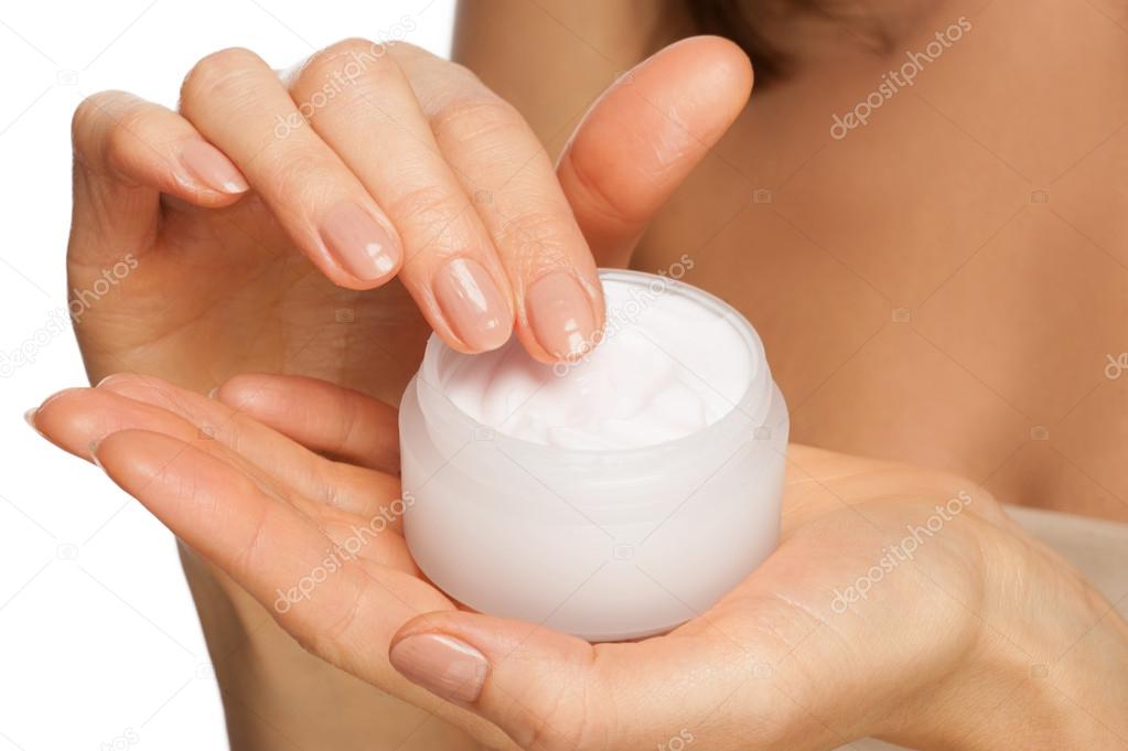 Woman applying hand cream Stock Photo by ©Dragonfly666 16861693