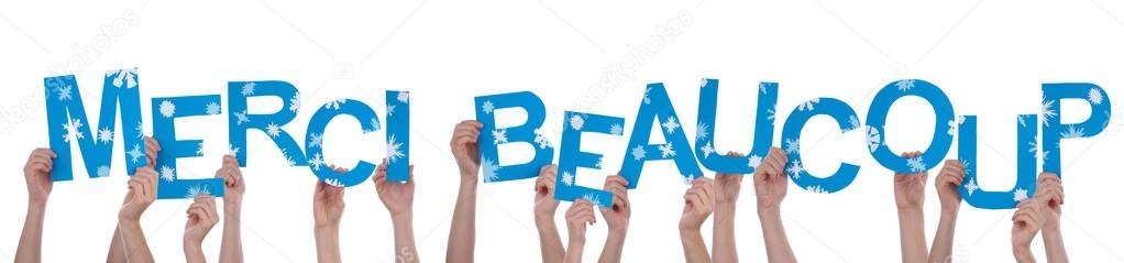 Hands Holding Merci Beaucoup — Stock Photo © Nelosa #33952799