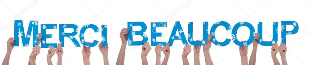People Holding Merci Beaucoup — Stock Photo © Nelosa #35163415