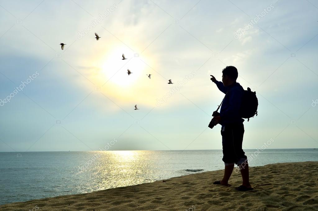 Photographer silhouette shooting sun rising — Stock Photo © shahril ...