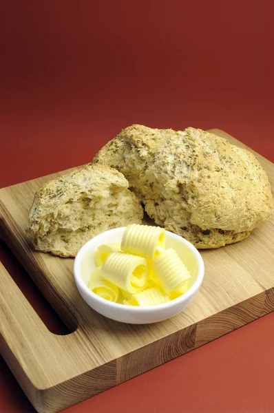 Australian traditional beer damper bread with butter curls Stock Photo ...