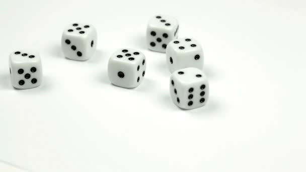 Throwing dice. The man gathers the cubes into a glass, shakes them and ...