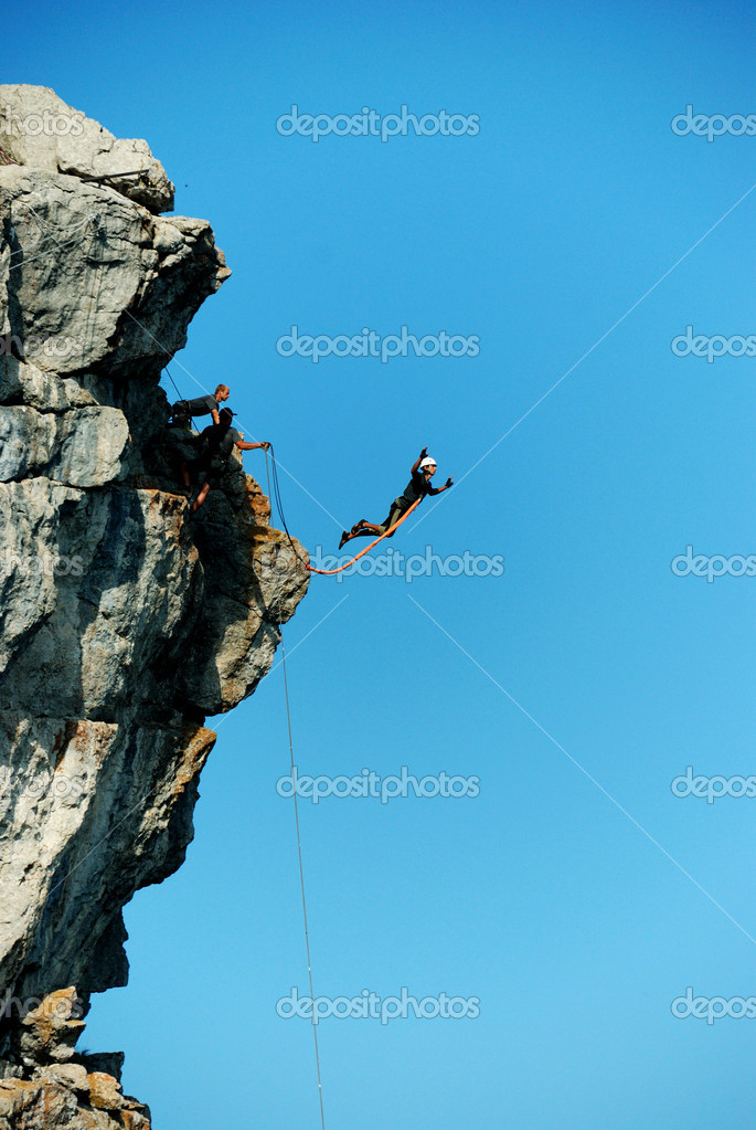Jump off a cliff with a rope. — Stock Photo © vetal1983 #14599681