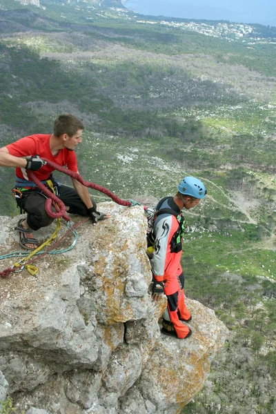 Risk rock climbing safety two people Stock Photos, Royalty Free Risk ...