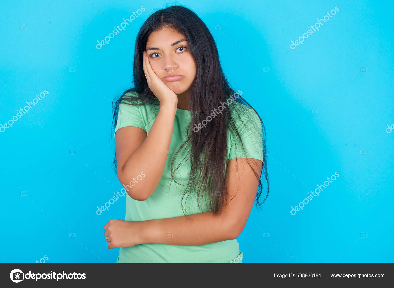Sad Lonely Young Hispanic Girl Wearing Green Shirt Blue Background ...