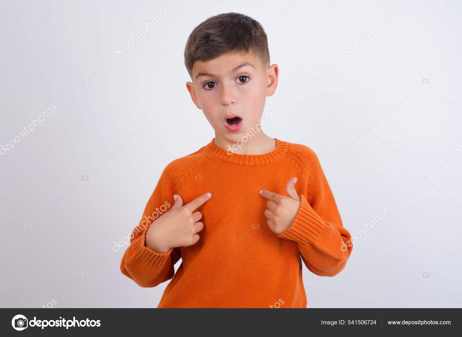 Embarrassed Caucasian Kid Boy Wearing Knitted Orange Sweater Standing ...