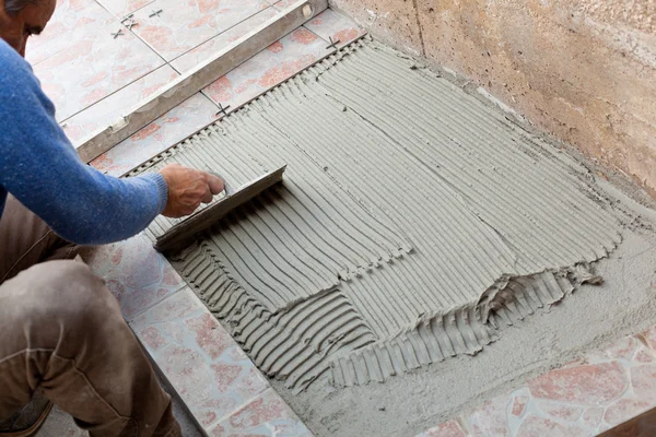 Tiler to work with tile flooring - Stock Image - Everypixel