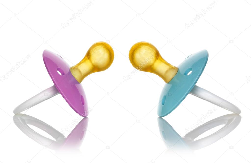 Babys pacifier pink and blue isolated on white background. — Stock ...