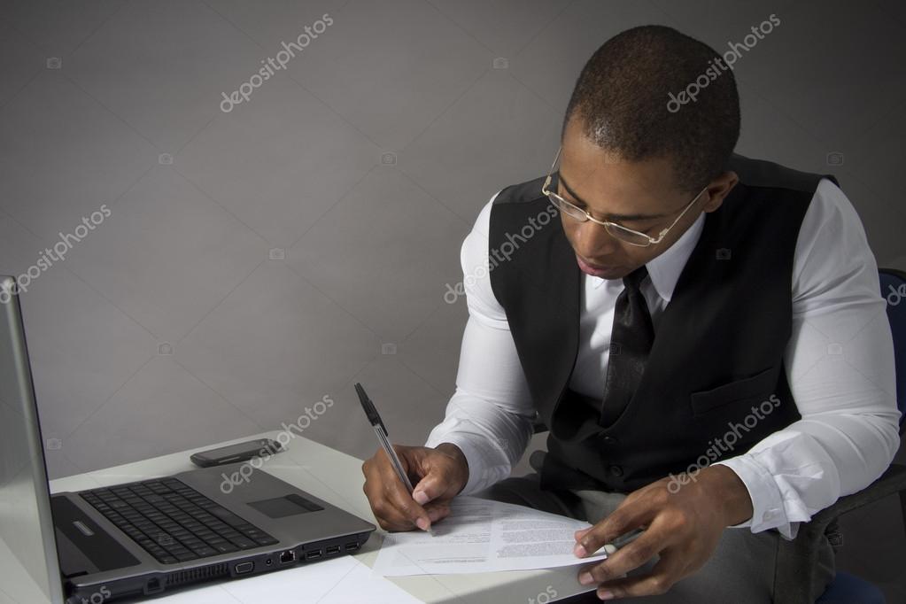 Black Person Writing On Paper