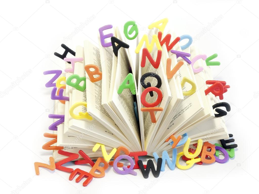 libro abierto con letras coloreadas — Foto de stock © roberaten #25809207
