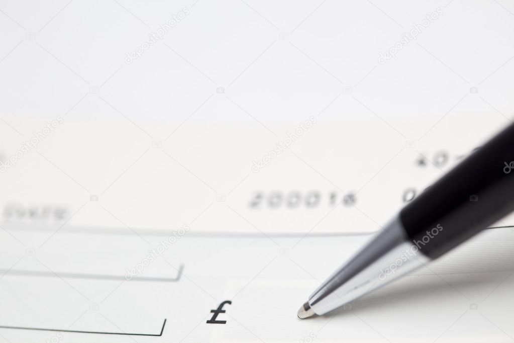 Writing a cheque — Stock Photo © SergeBertasiusPhotography #16783419
