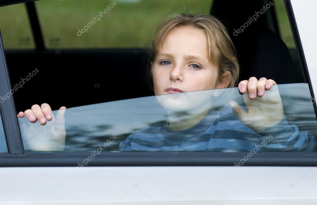 Sad girl in car — Stock Photo © halfpoint #15356647
