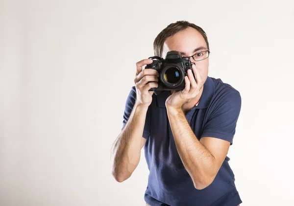 Young pro photographer with digital camera — Stock Photo © lightpoet ...