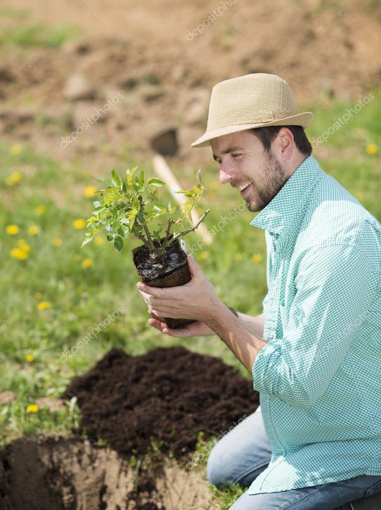Man planting a tree Stock Photo by ©halfpoint 45758967