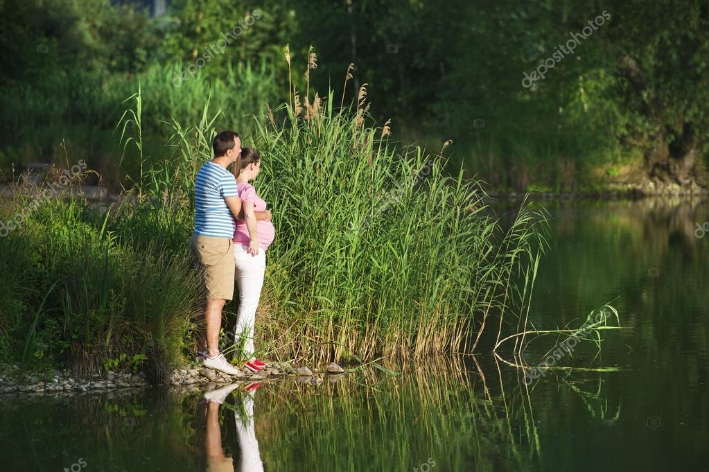 Couple hugging in nature Stock Photo by ©halfpoint 48637513