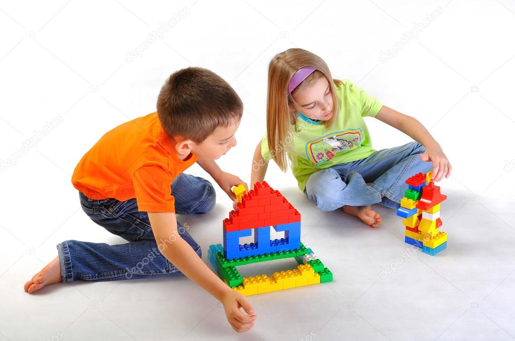 Kids playing with constructor Stock Photo by ©stelado 21111825