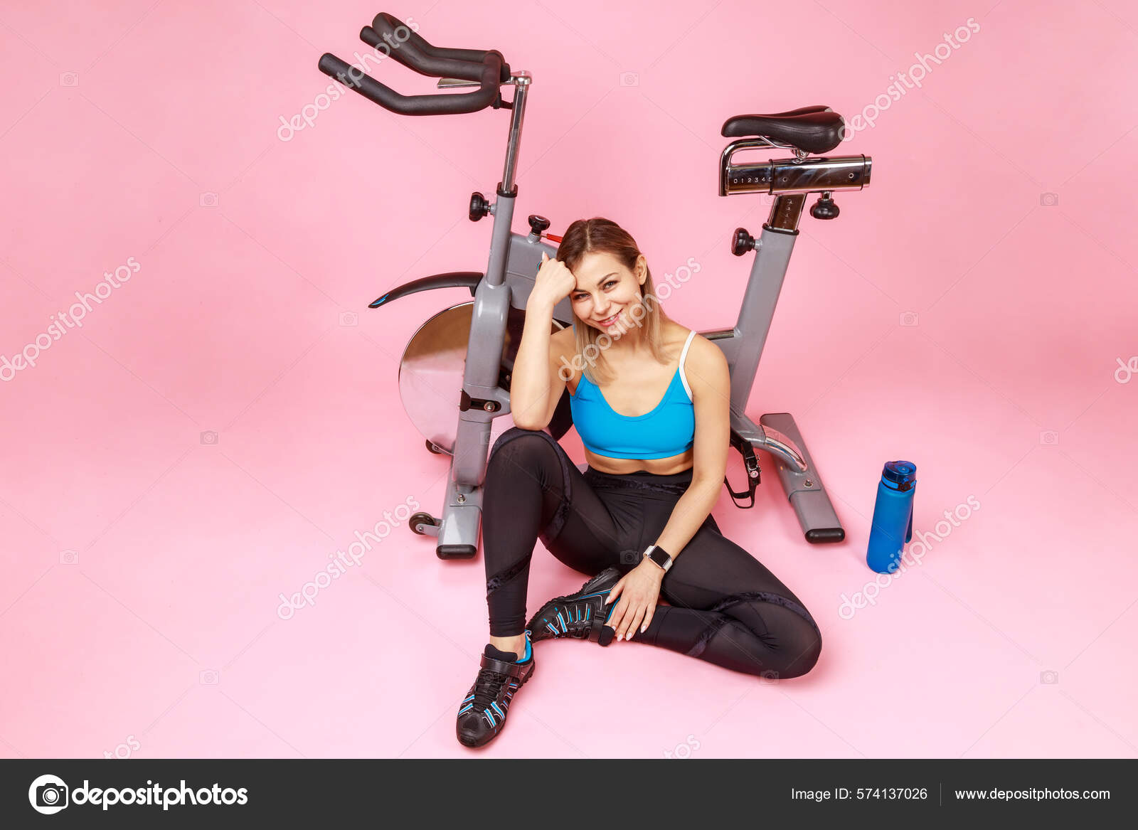 Smiling Sporty Woman Blonde Hair Sitting Floor Exercise Bike Looking Stock Photo by ©khosrork ...