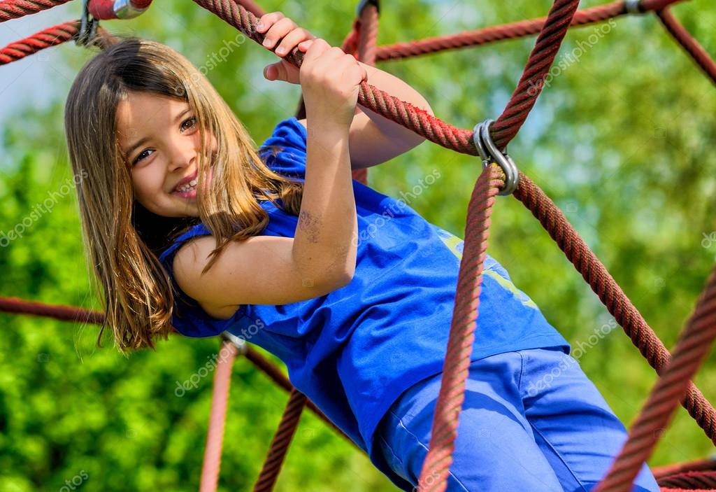 Pretty girl doing rock climbing Stock Photo by ©Pixinooo 26471899