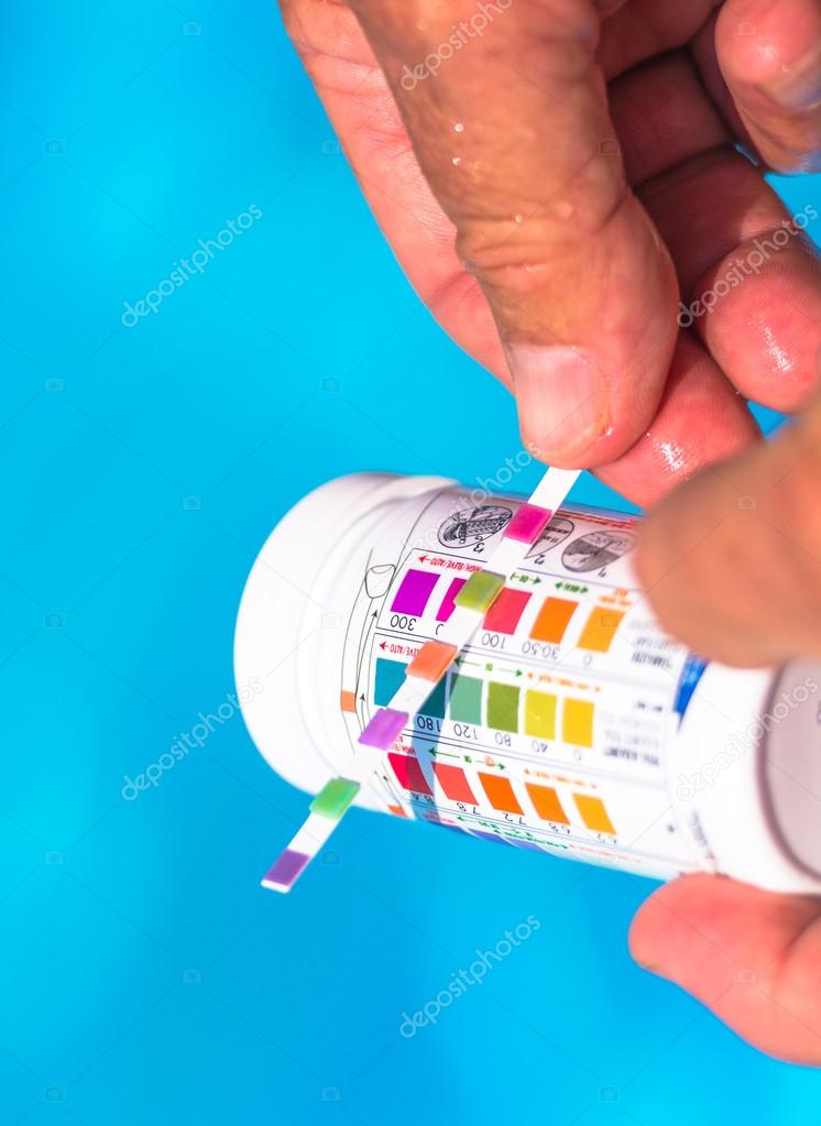 Check the Ph of a private swimming pool — Stock Photo © Pixinooo #35032445