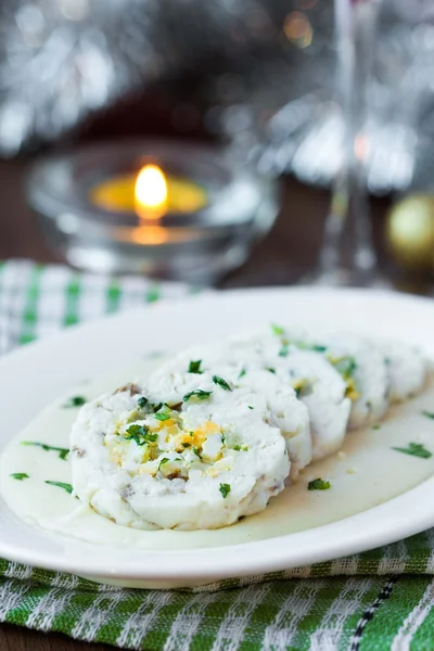 Roulade roll of white fish fillet cod stuffed with egg, sauce be ...