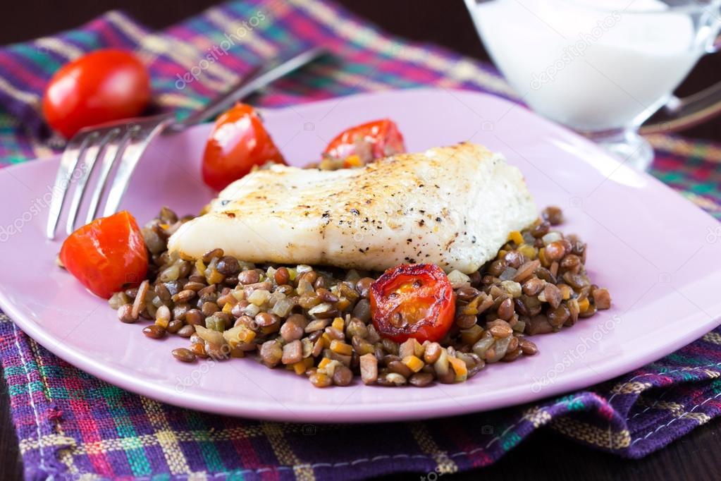 White fish fillet of perch, cod with vegetables and lentils, tom ...