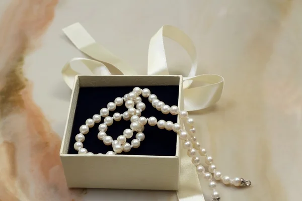 Pearl necklace and gift box Stock Photo by ©rossella71 23623635