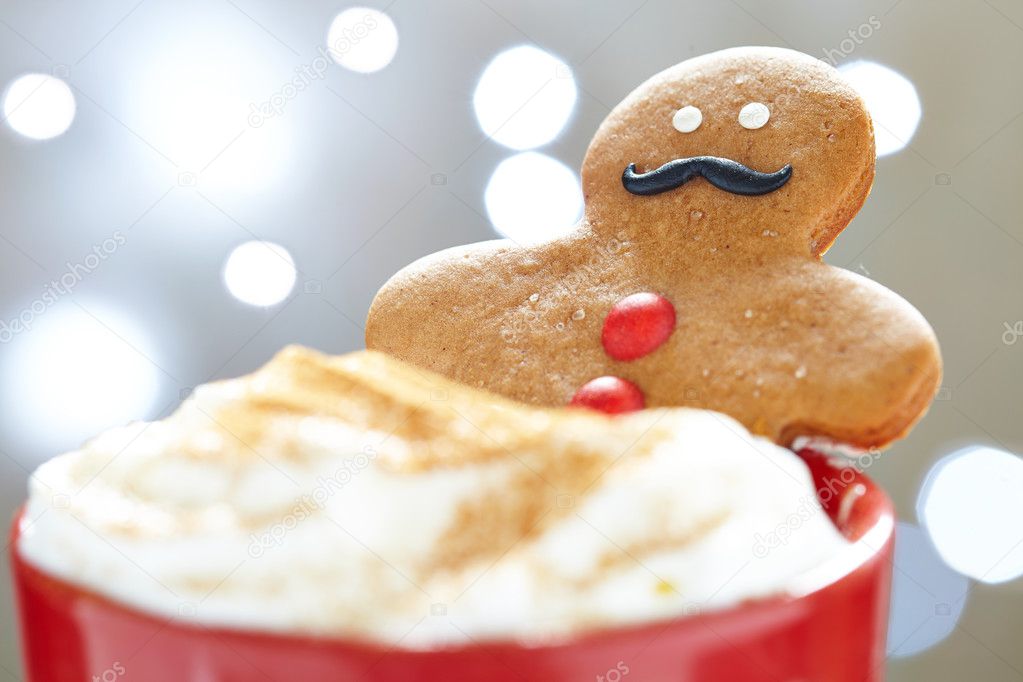 Gingerbread man in hot chocolate — Stock Photo © Odelinde #33940749