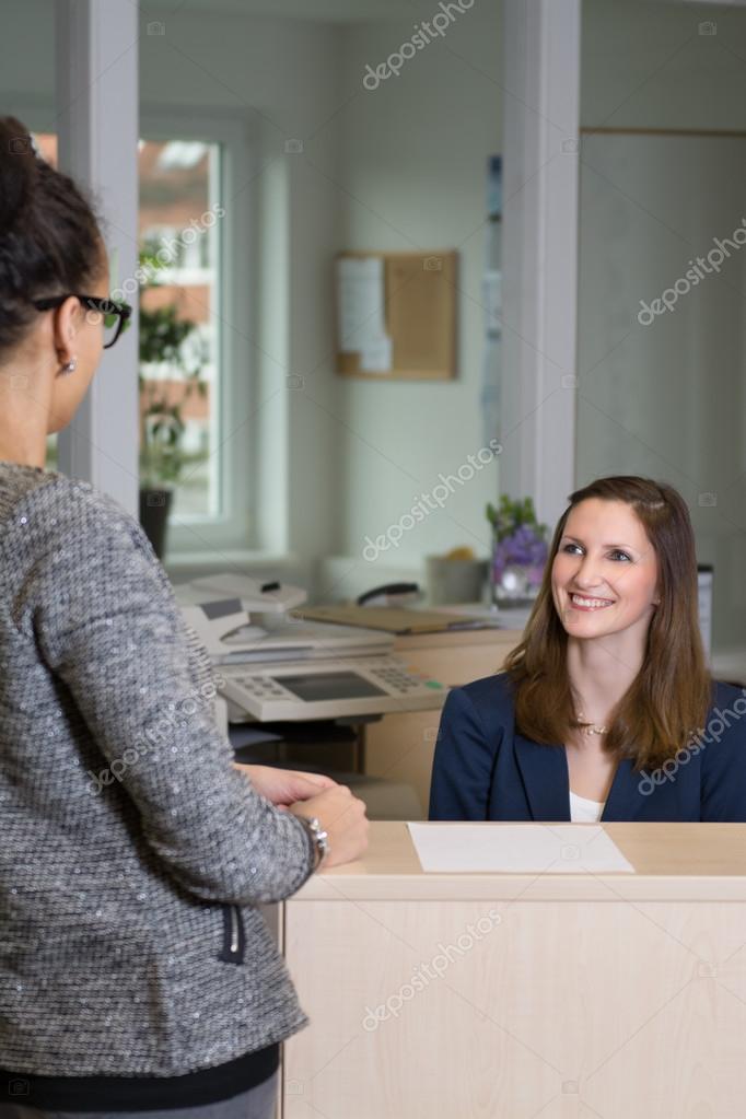 Clerk is smiling to a customer Stock Photo by ©FrankMerfort 46294445