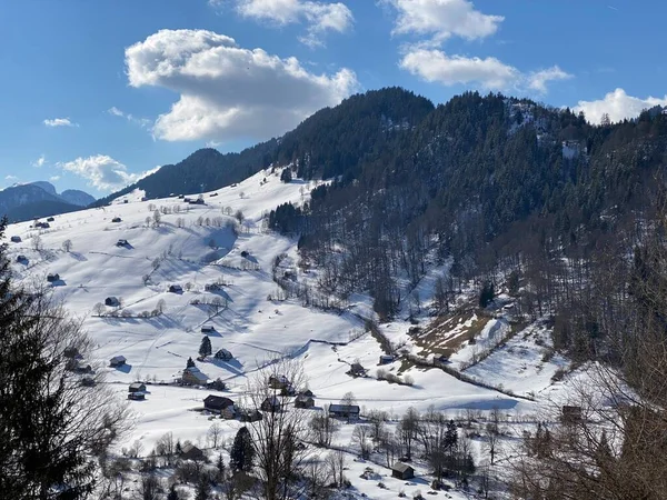 Snow-covered high alpine pastures and rocky peaks of the Alpstein ...