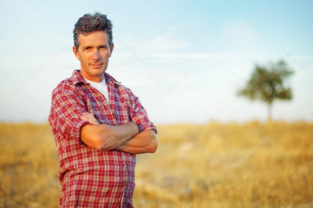 Handsome man on the field Stock Photo by ©apid 19922587