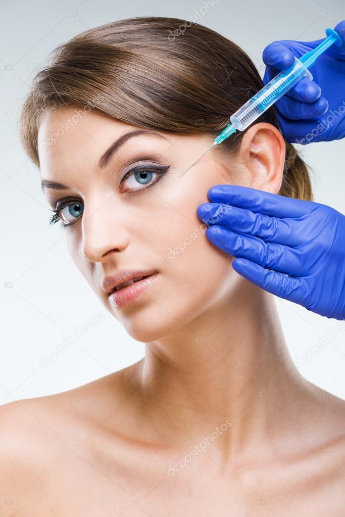 Beautiful woman face with hypodermic needle Stock Photo by ©Geribody ...