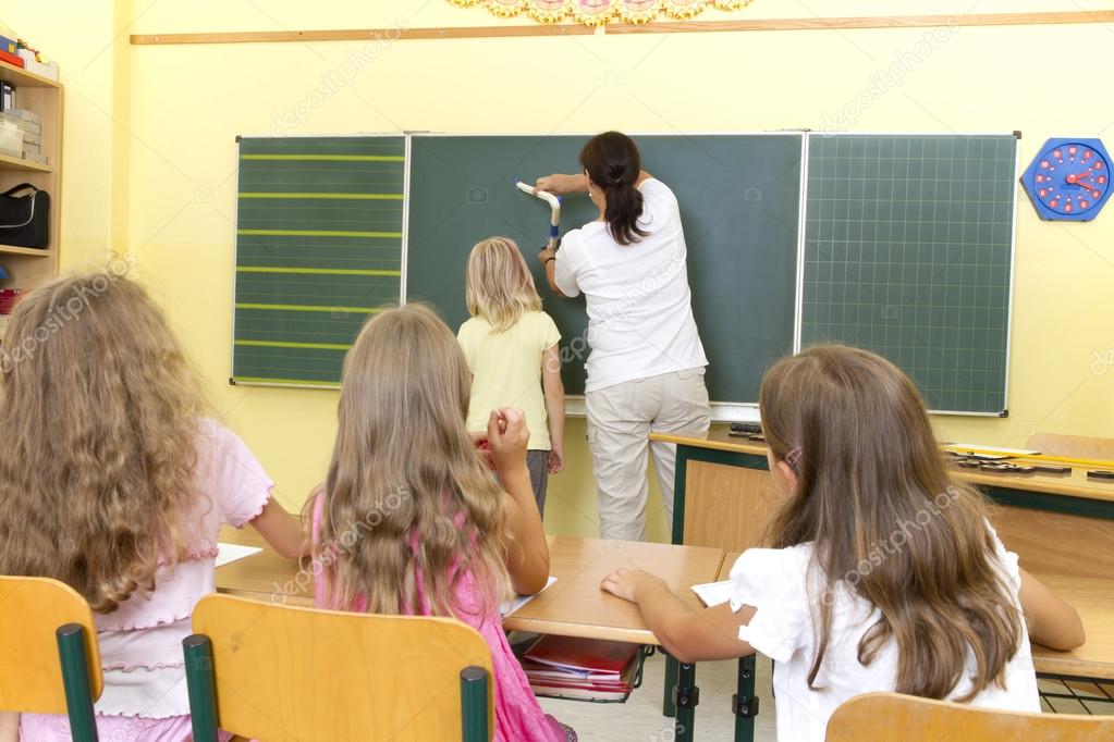 Teacher in a classroom — Stock Photo © robertmandel #24404671