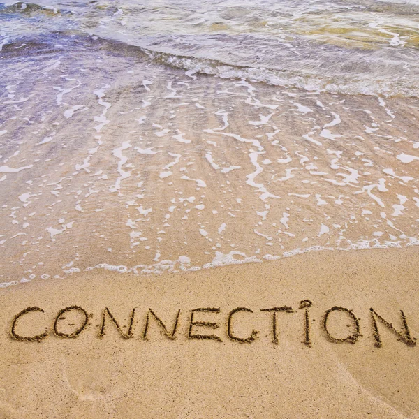 Connection word written on sand, with waves in background — Stock Photo ...