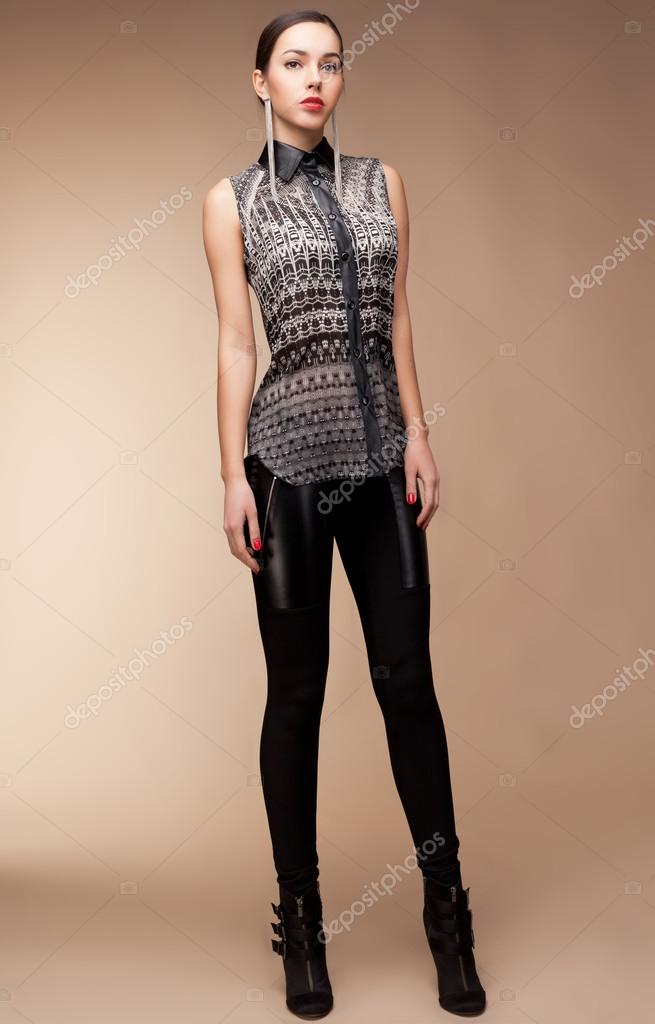Attractive woman.Studio set .outfits Stock Photo by ©ooGleb 41483959