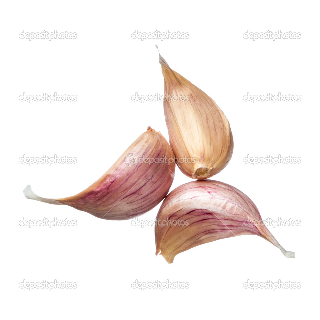 Three garlic cloves isolated on white background Stock Photo by ...