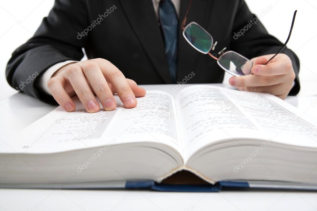 Man is looking for information in the dictionary — Stock Photo © mizar ...