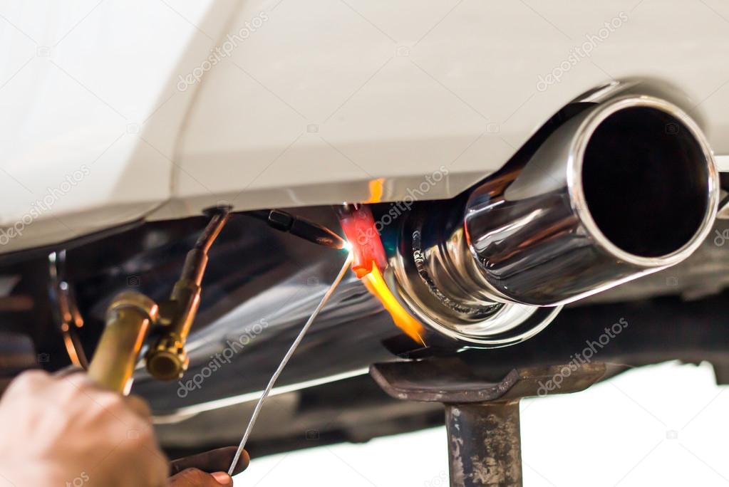Cars pipe installation Stock Photo by ©photoraidz 44008407