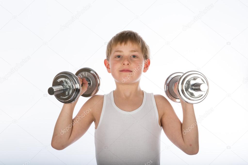 Young boy exercising with two dumbbells Stock Photo by ©imagox 16943771