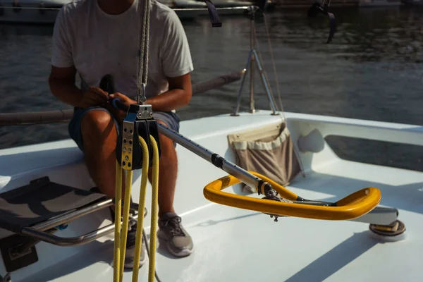 beginner courses for men on a sailing yacht. a man controls the ...