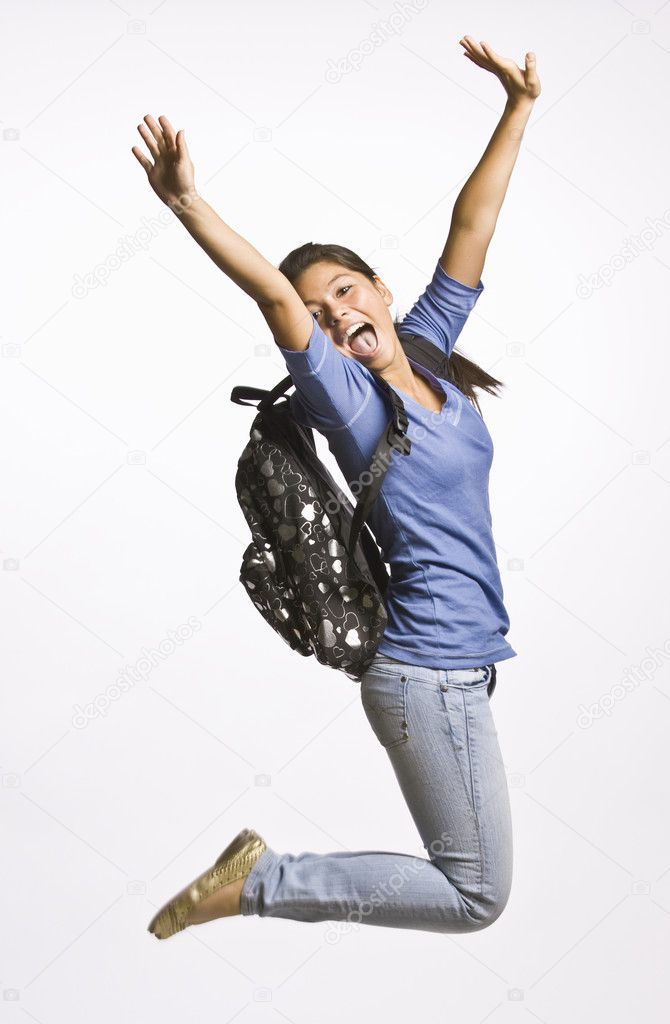 Student wearing backpack jumping Stock Photo by ©Spaces 18787247