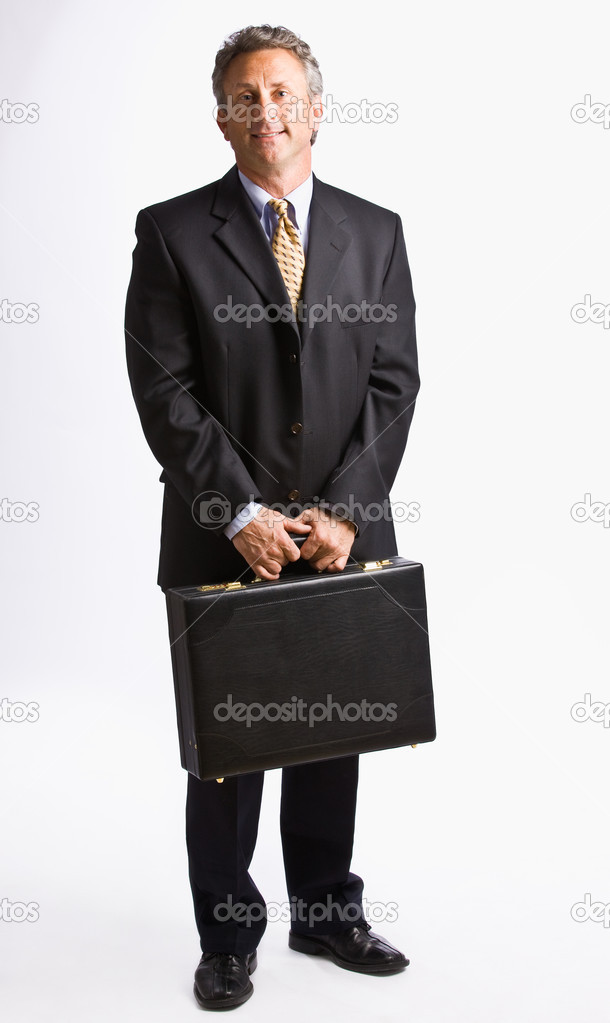 Businessman carrying briefcase Stock Photo by ©Spaces 18795553 Businessman carrying briefcase Stock Photo by ©Spaces 18795553