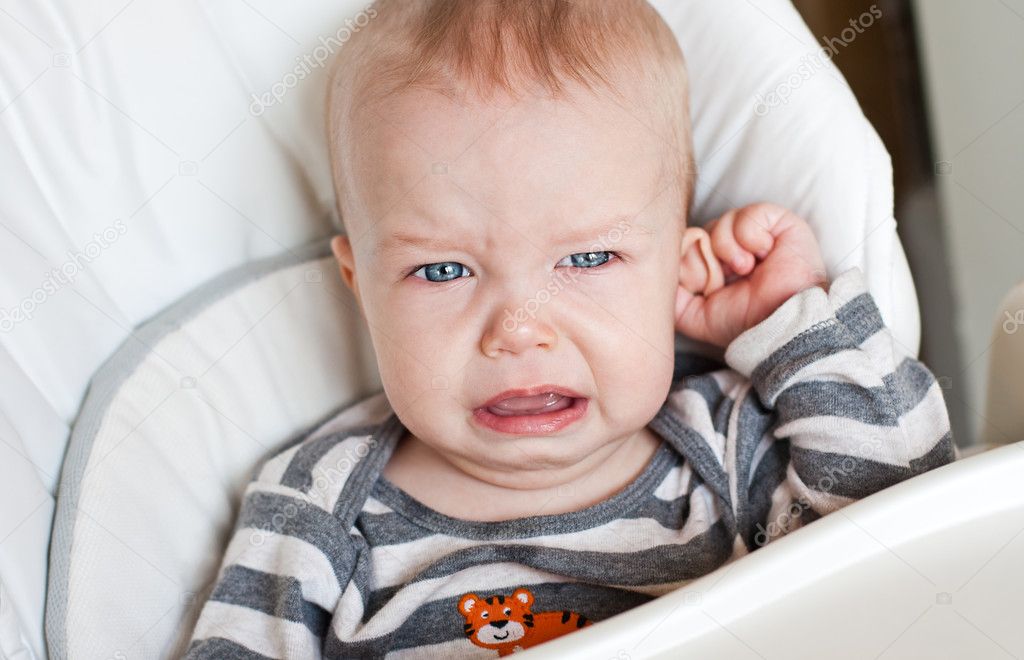 Cute little boy crying holding his ear — Stock Photo © marchibas #34452939
