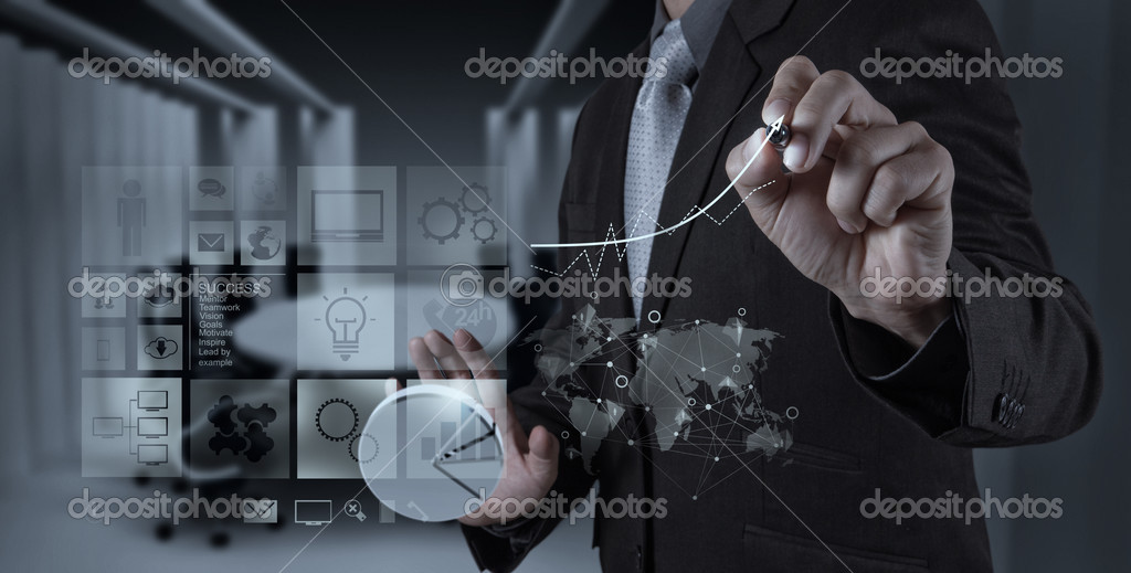 Businessman hand working with new modern computer and business s ...