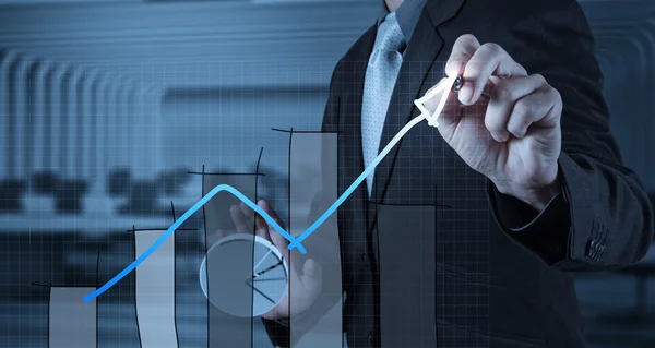 Businessman hand working with new modern computer and business s ...